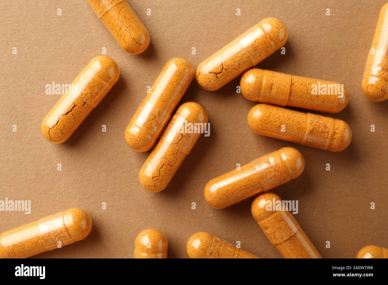 Turmeric capsules on beige background, flat lay Stock Photo - Alamy