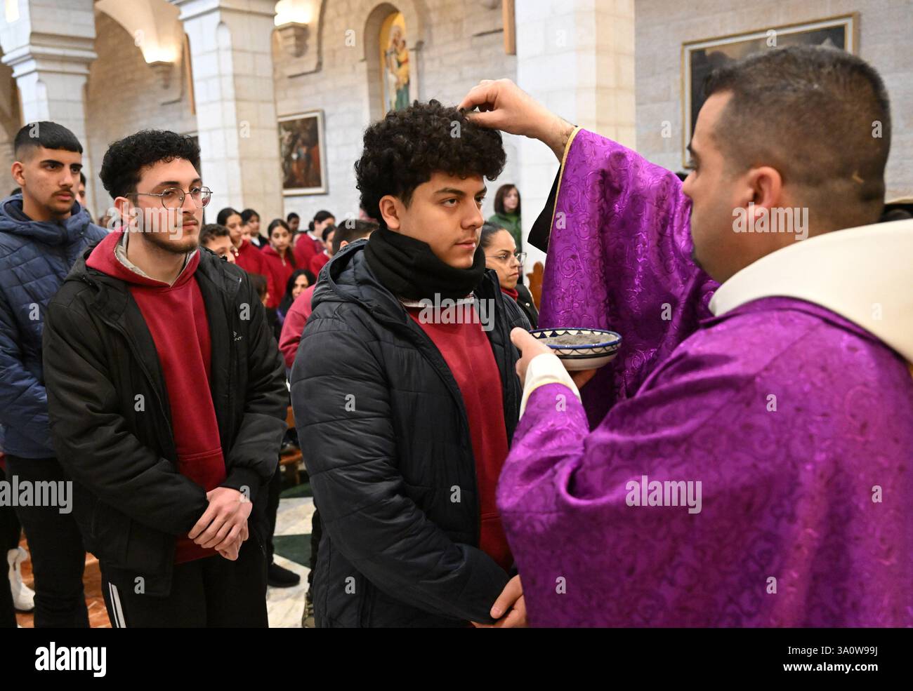 Bethlehem, West Bank. 05th Mar, 2025. A Catholic priest sprinkles ashes ...