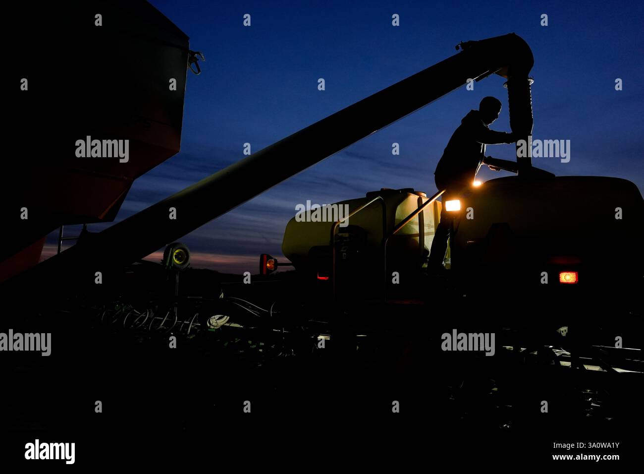 FILE - Mark Woodruff loads more soybean seeds into a planter April 22 ...