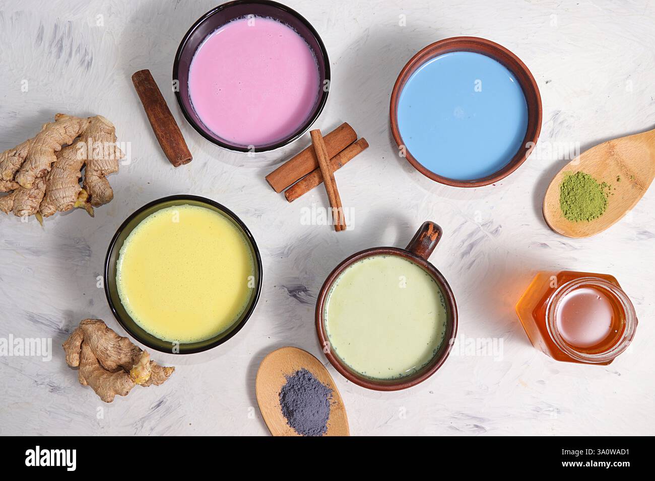 An assortment of colorful latte Japanese tea, matcha green, blue, pink ...