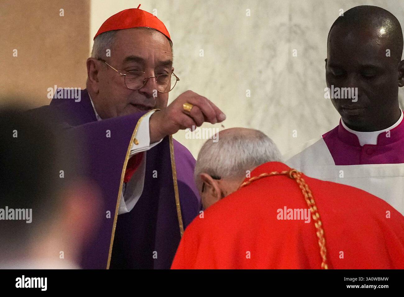 Cardinal Major Penitentiary Angelo De Donatis, left, sprinkles ashes ...