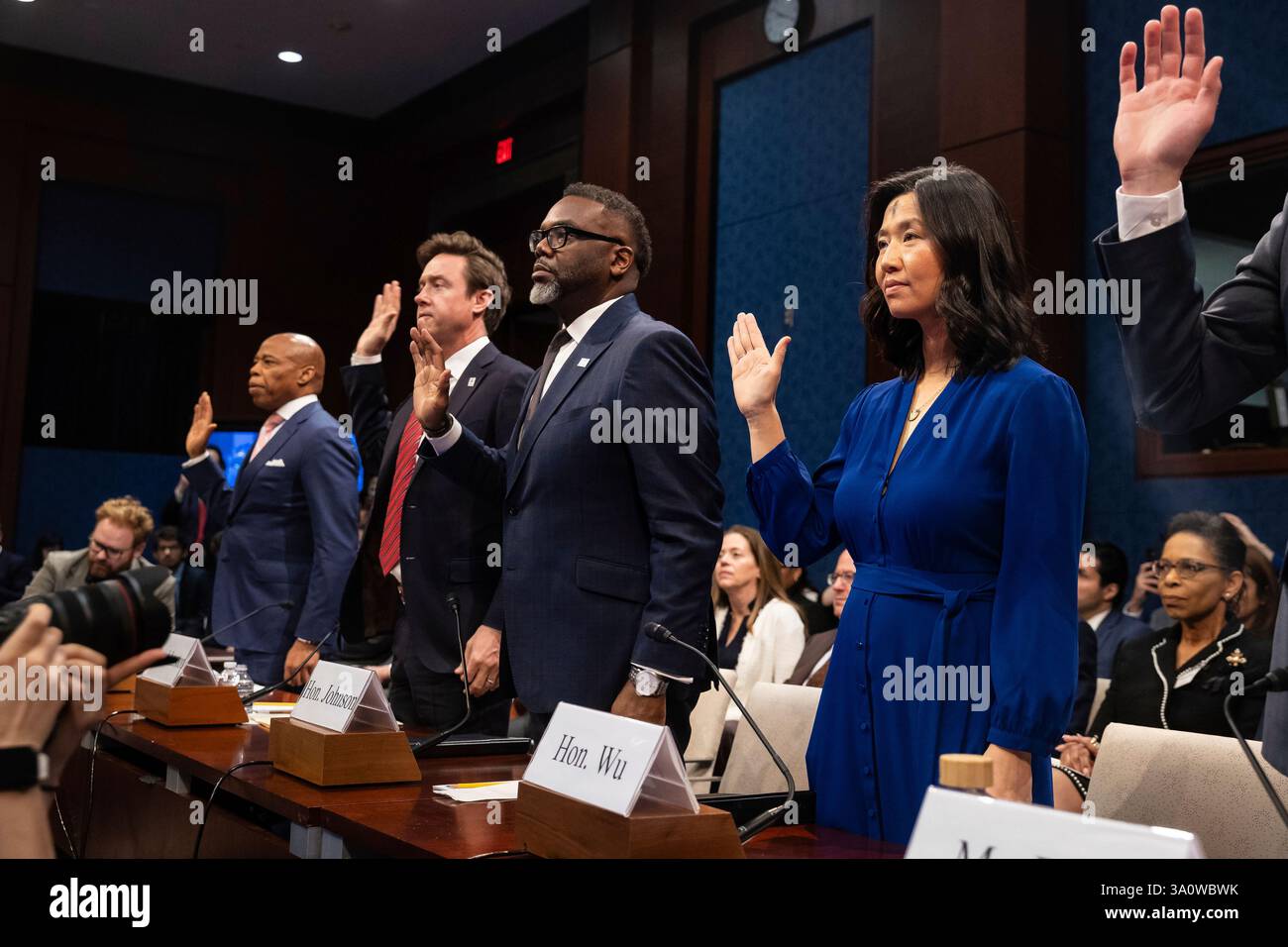 From left, New York City Mayor Eric Adams, Denver Mayor Mike Johnston ...