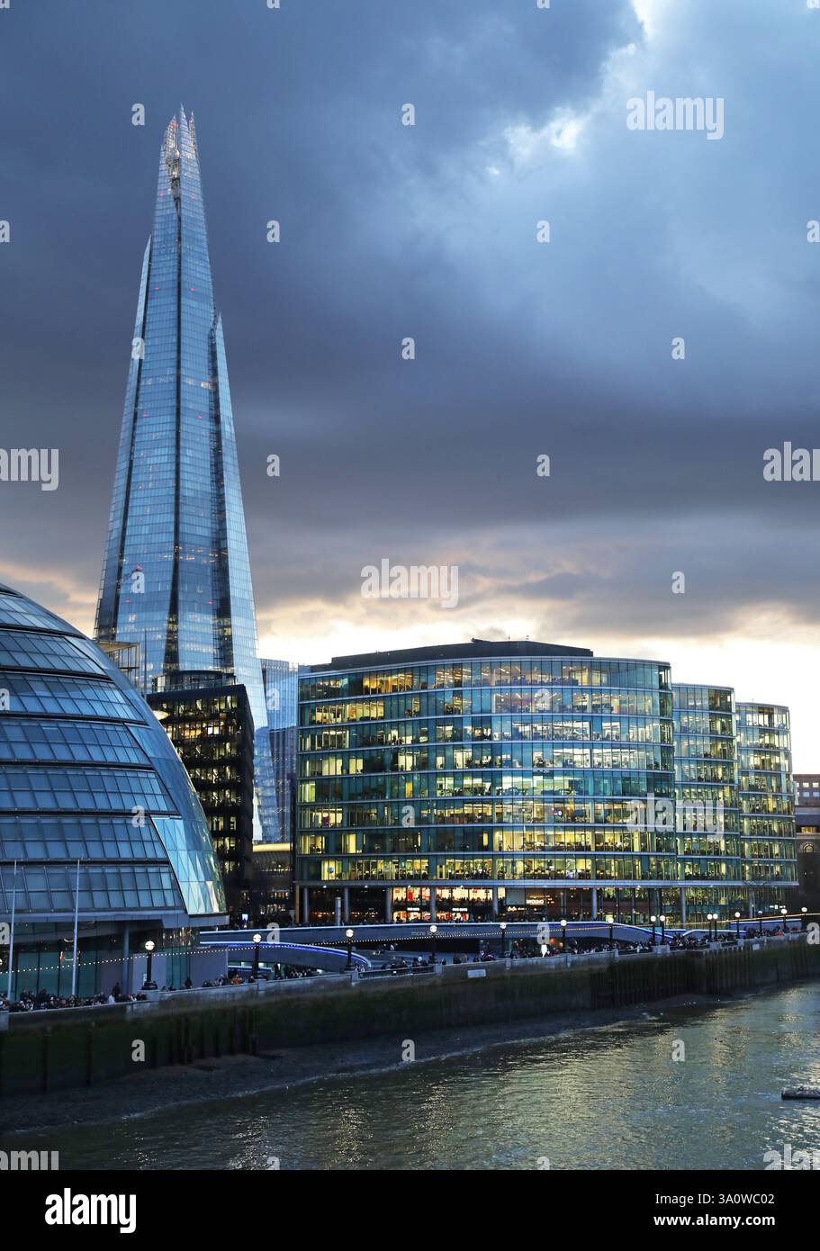 Dusk view of the More London office development by the River Thames ...