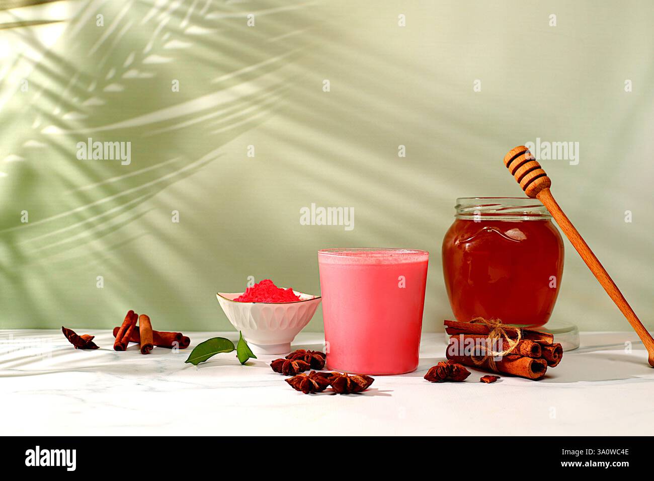 Pink moon milk matcha latte with cinnamon, anise and honey spices on ...