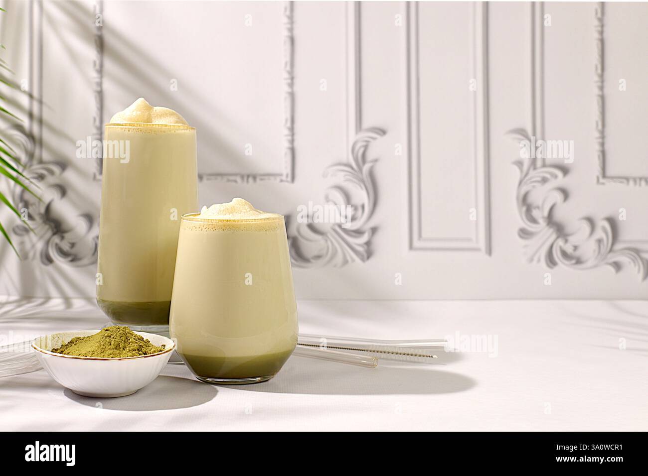 Green tea matcha latte with milk on elegant kitchen sunny background ...