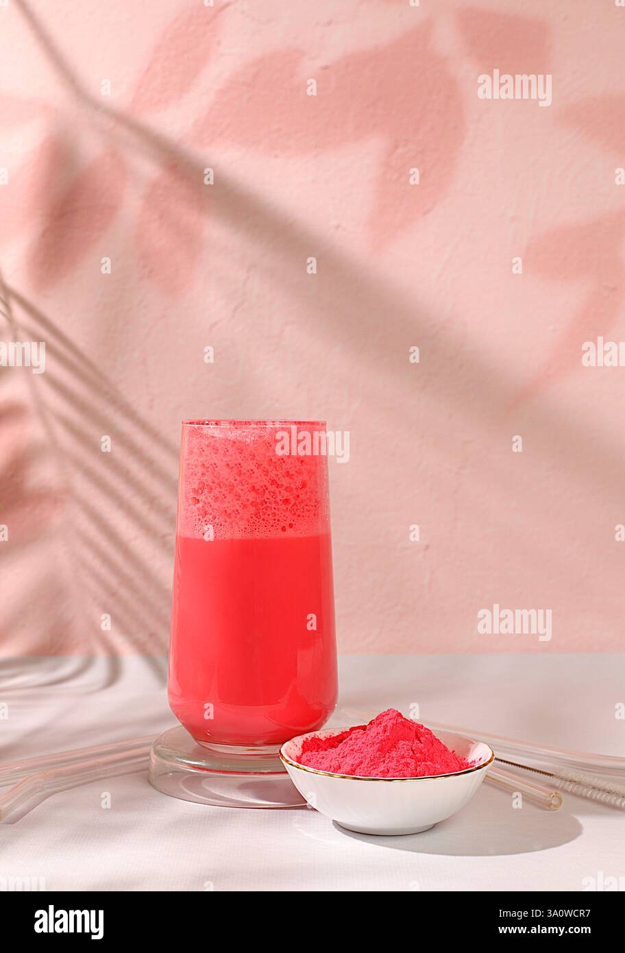 Pink matcha tea latte with milk on elegant kitchen sunny background ...