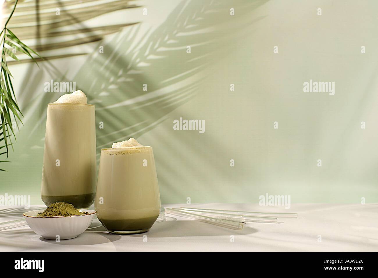 Green tea matcha latte with milk on elegant kitchen sunny background ...
