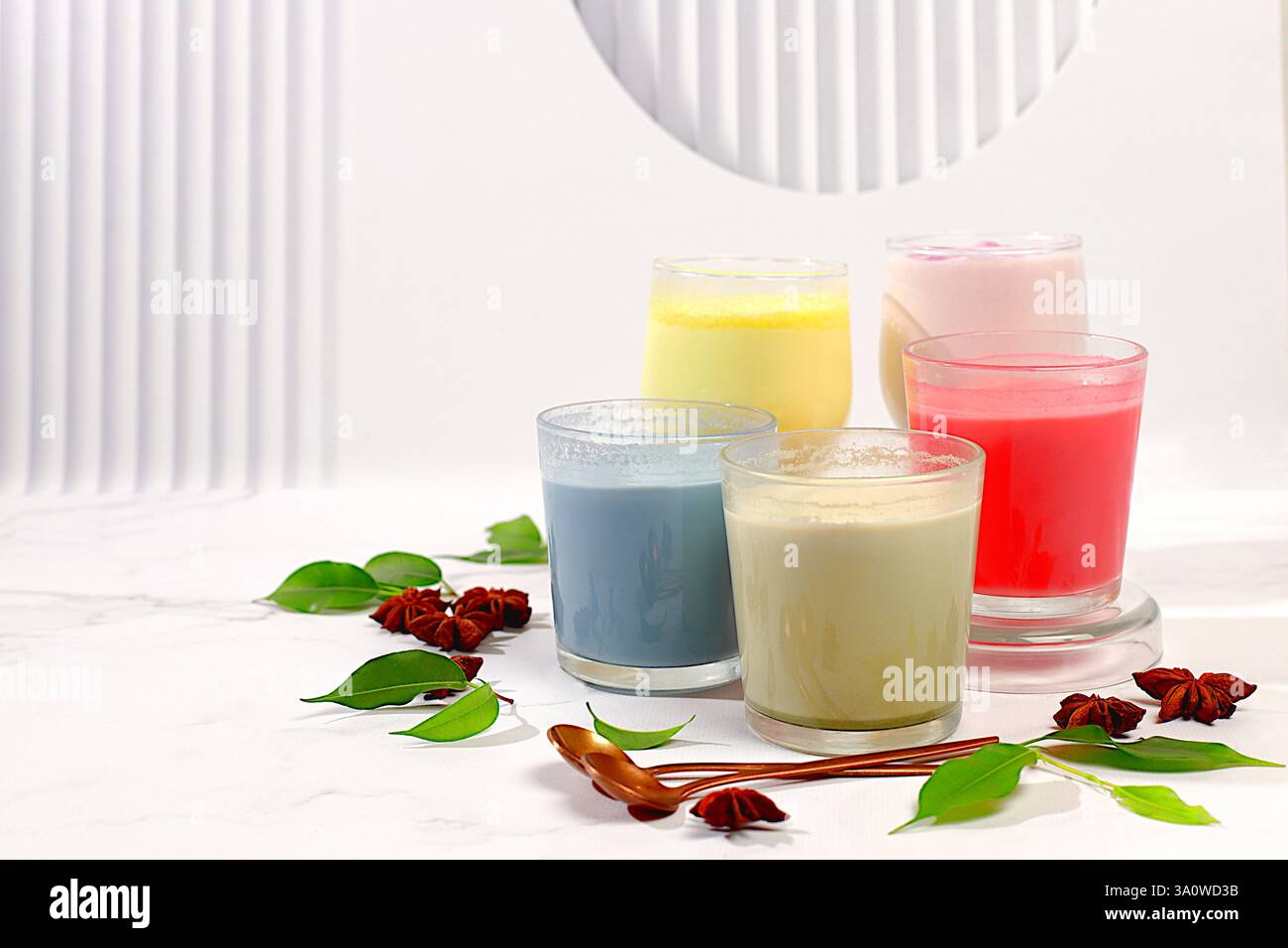 Assortment of different matcha chai lattes with milk on elegant kitchen ...