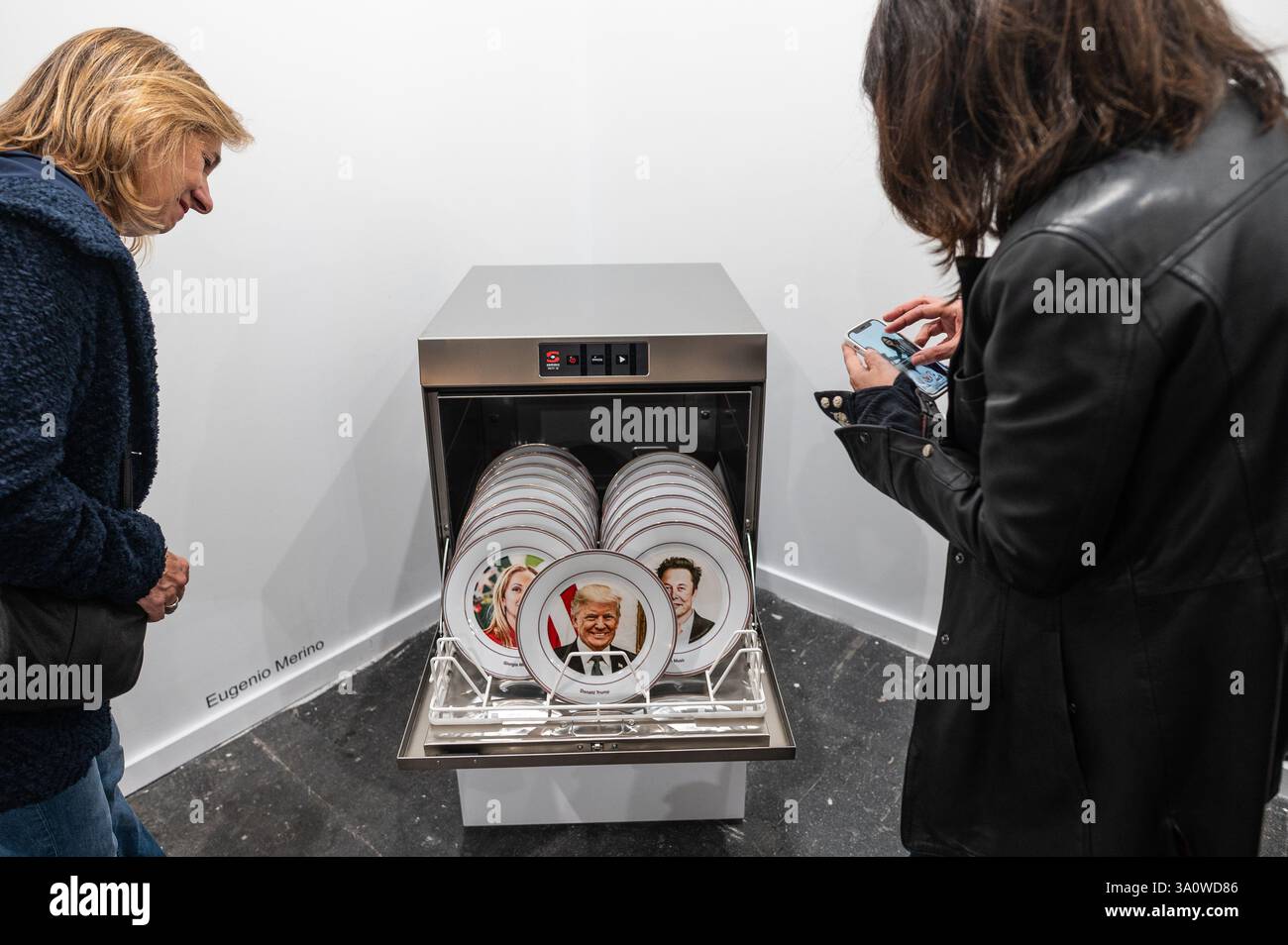Visitors observe the artwork "White Washing" by artist Eugenio Merino ...