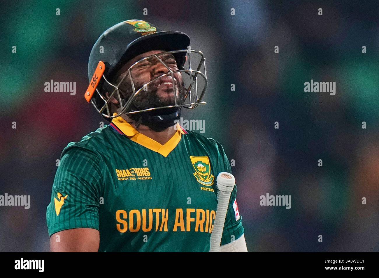South Africa's captain Temba Bavuma reacts as he walks off the field ...