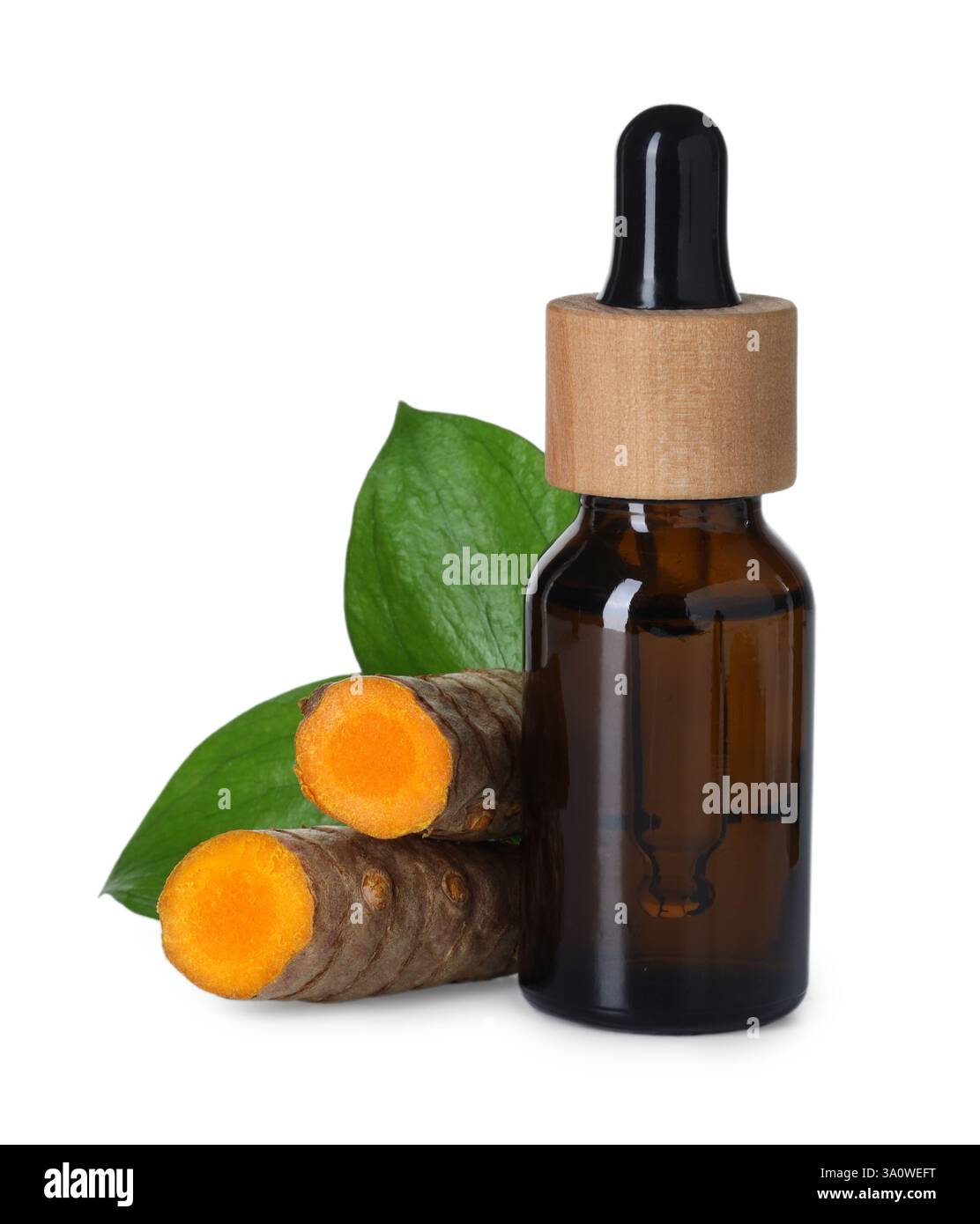 Bottle of turmeric essential oil, raw roots and leaves isolated on ...