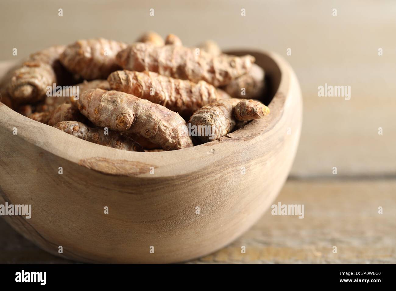 Whole turmeric in bowl hi-res stock photography and images - Alamy