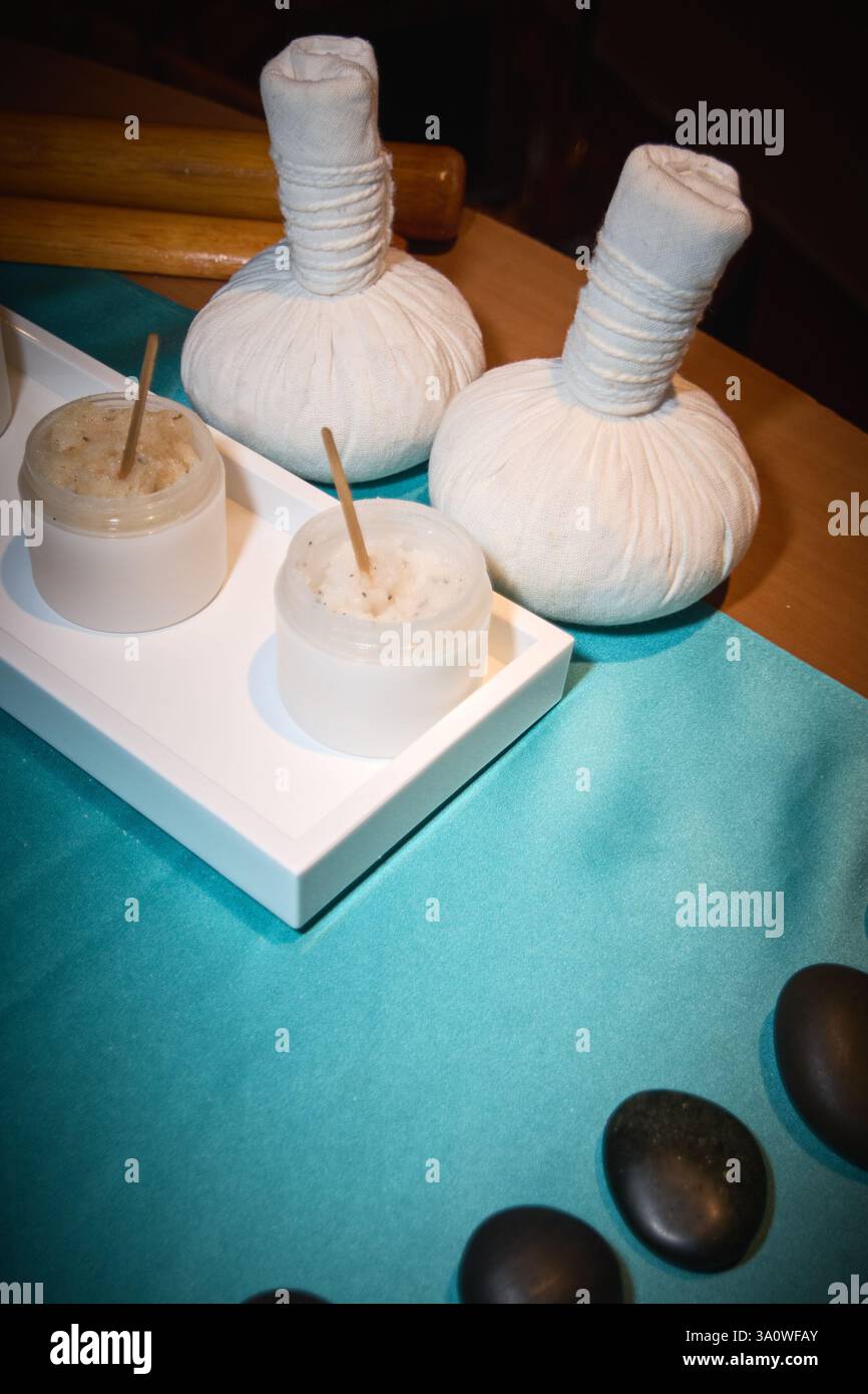 Herbal compress and bamboo sticks for spa Stock Photo - Alamy