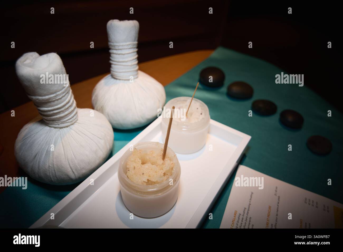 Traditional herbal compress and massage sticks Stock Photo - Alamy