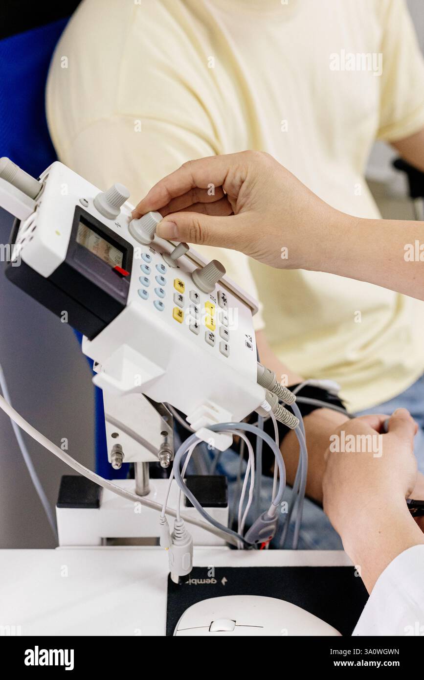 The patient undergoes an electromyography (EMG) test to assess nerve ...