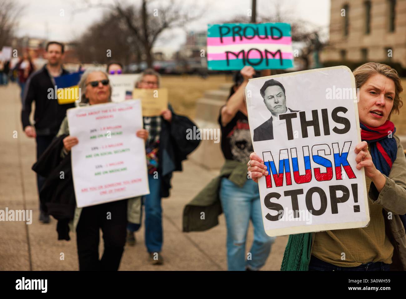 INDIANAPOLIS, INDIANA - MARCH 4: A protesters holds a sign reading ...