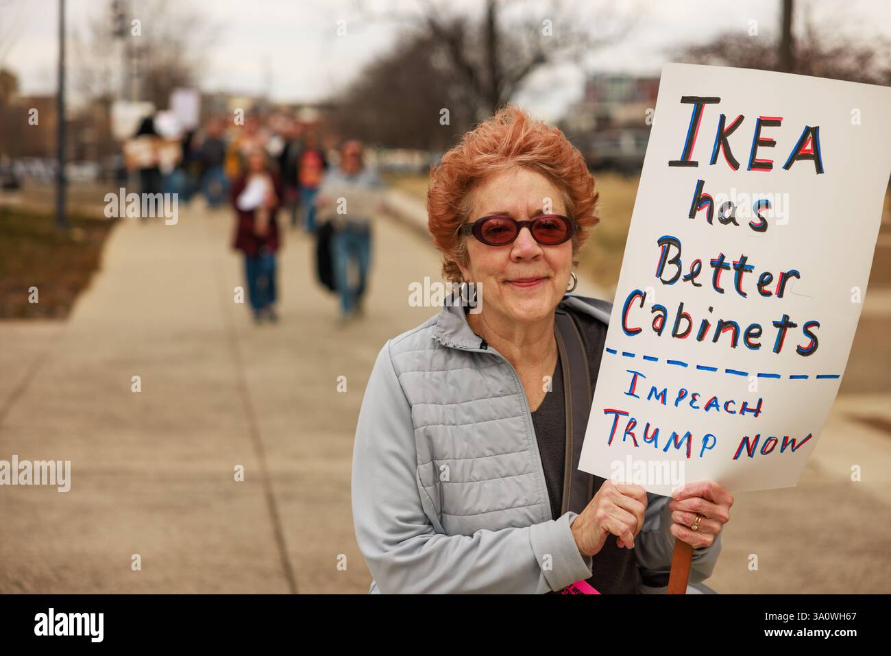 INDIANAPOLIS, INDIANA - MARCH 4: A protesters holds a sign reading ...