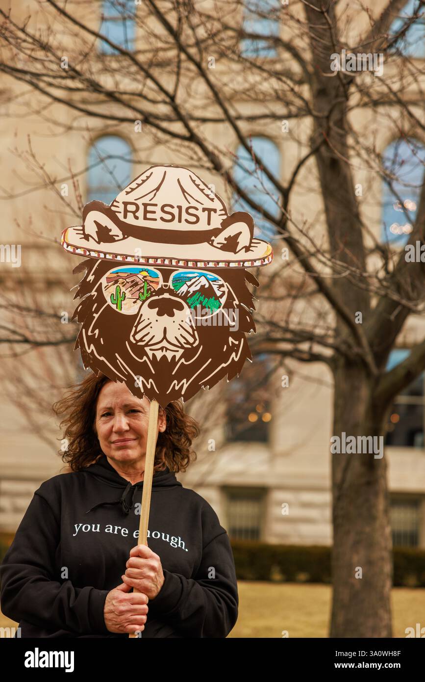INDIANAPOLIS, INDIANA - MARCH 4: A protesters holds a sign reading ...