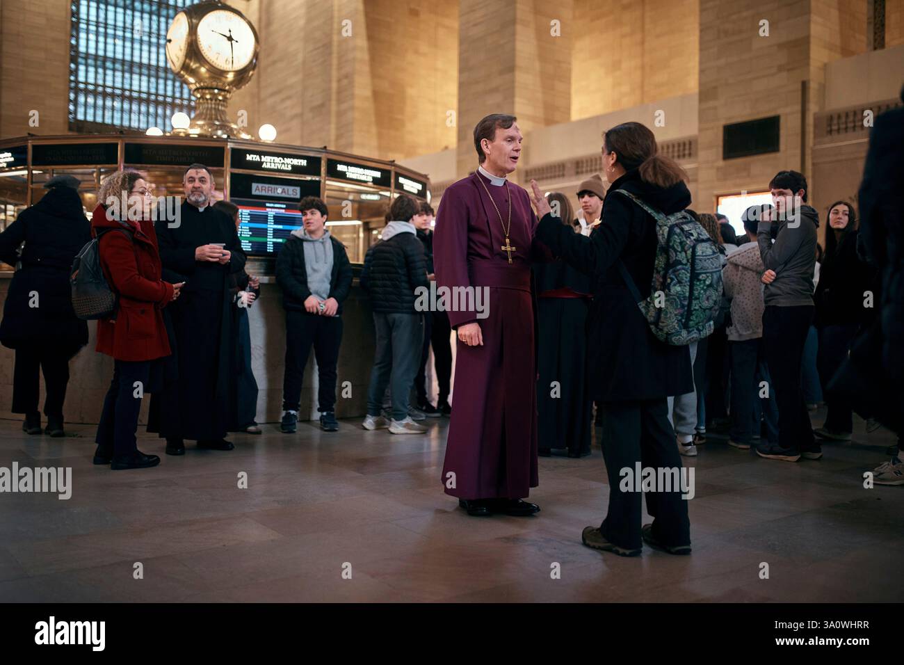 Rev. Matthew Heyd, the 17th Episcopal Bishop of New York, center, talks ...