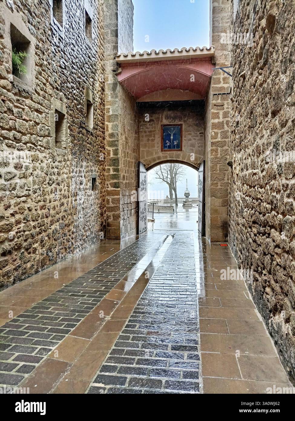 Wet cobblestone street in the medieval town of Laguardia, Alava, Spain ...
