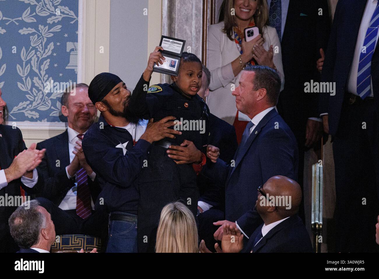 Cancer survivor Devarjaye "DJ" Daniel is applauded as President Donald ...