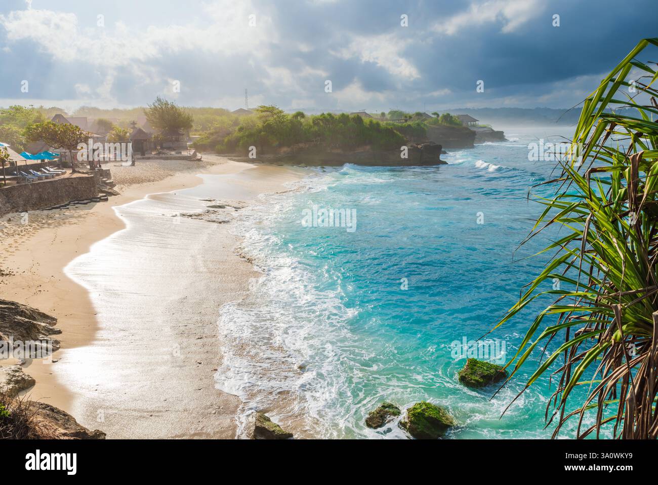 Tropical paradise beach with ocean and cloudy sky with sun rays in ...
