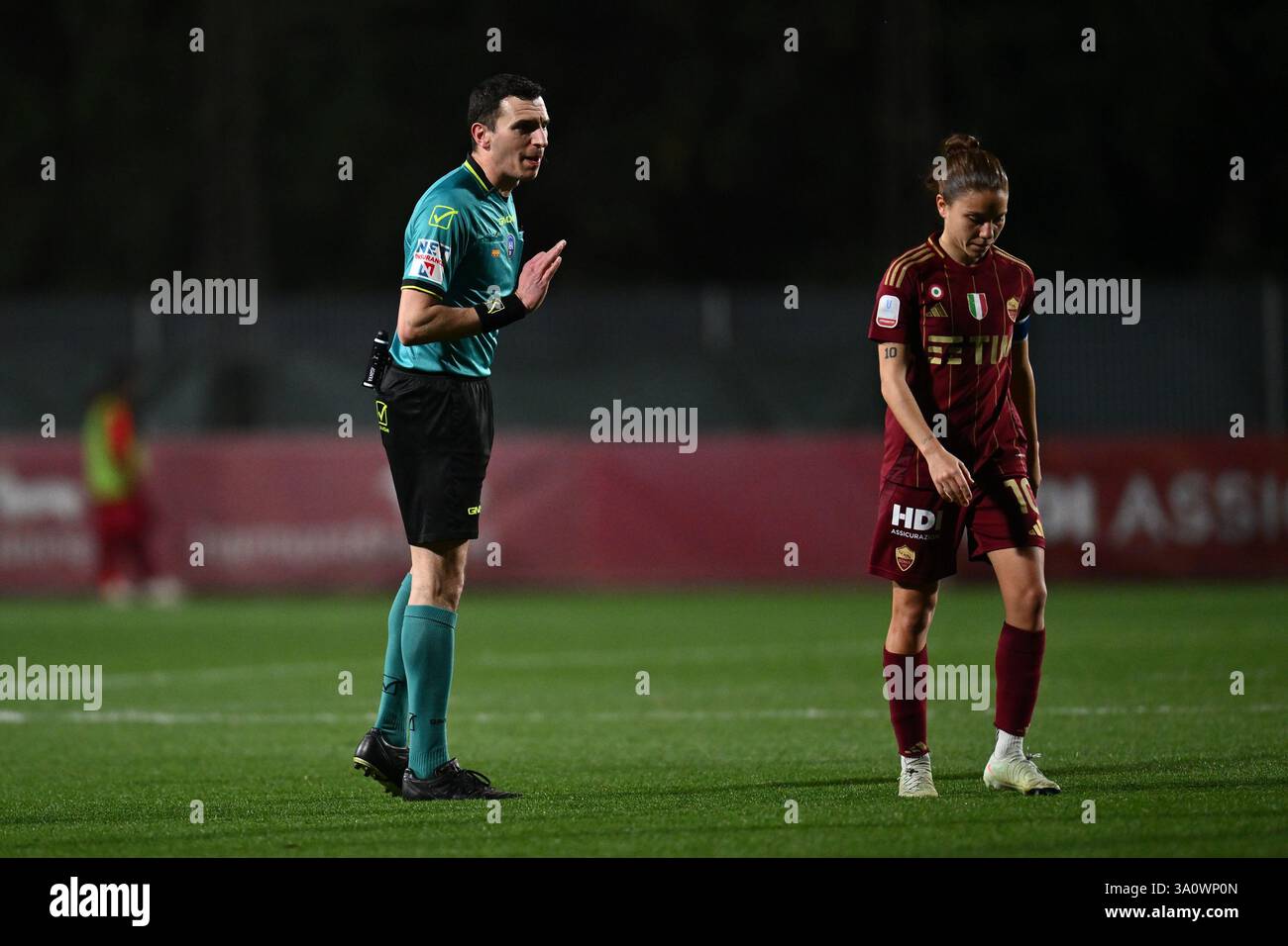 Referee Francesco Zago and Manuela Giugliano of A.S. Roma Femminile ...