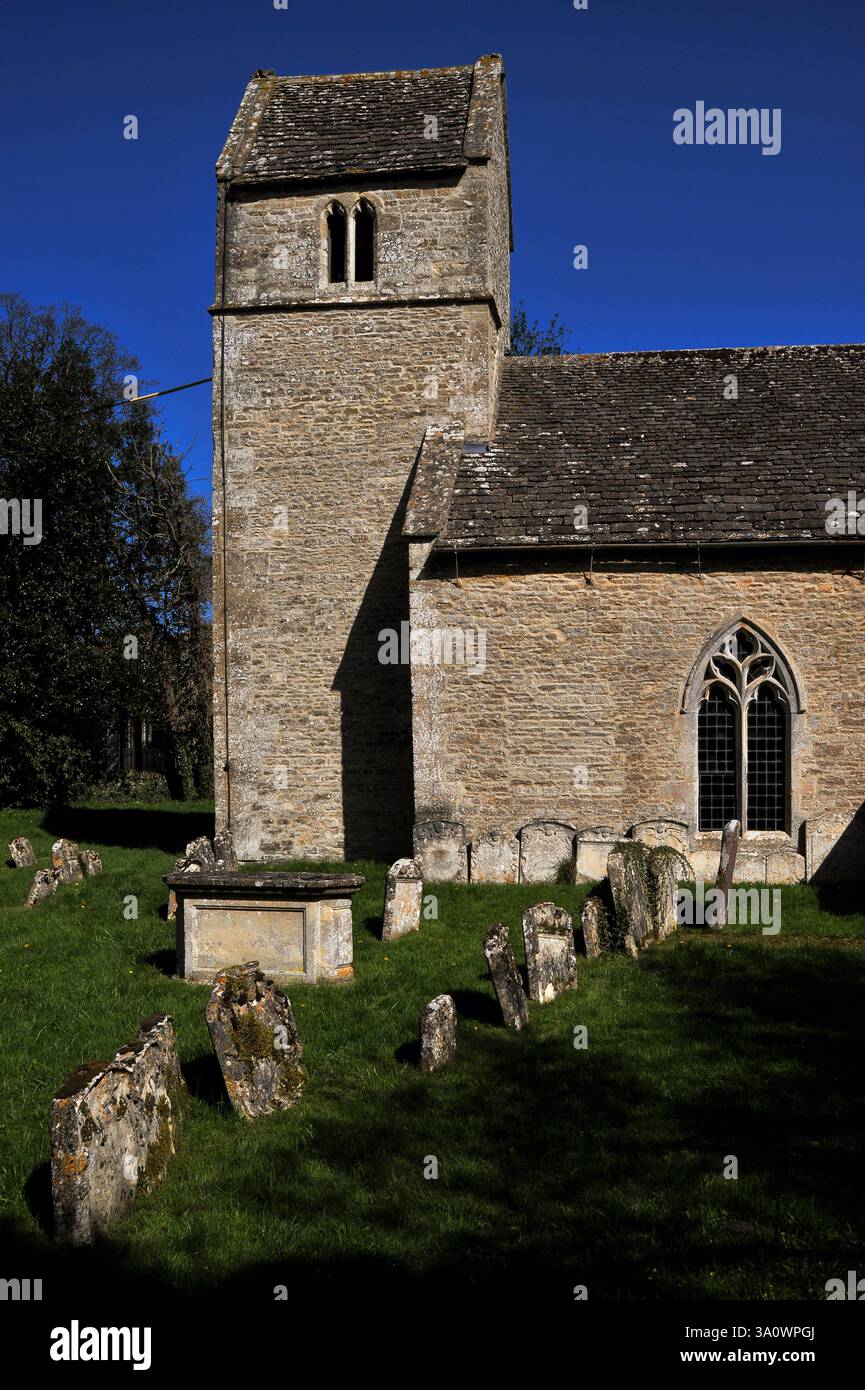 A medieval saddleback tower roof and delicate tracery in a 14th century ...