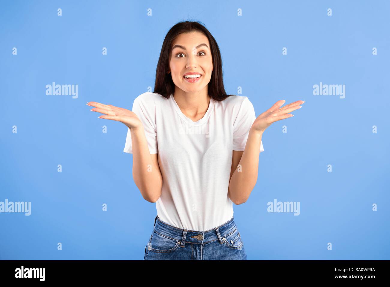 Confused puzzled young lady shrugging at studio Stock Photo - Alamy