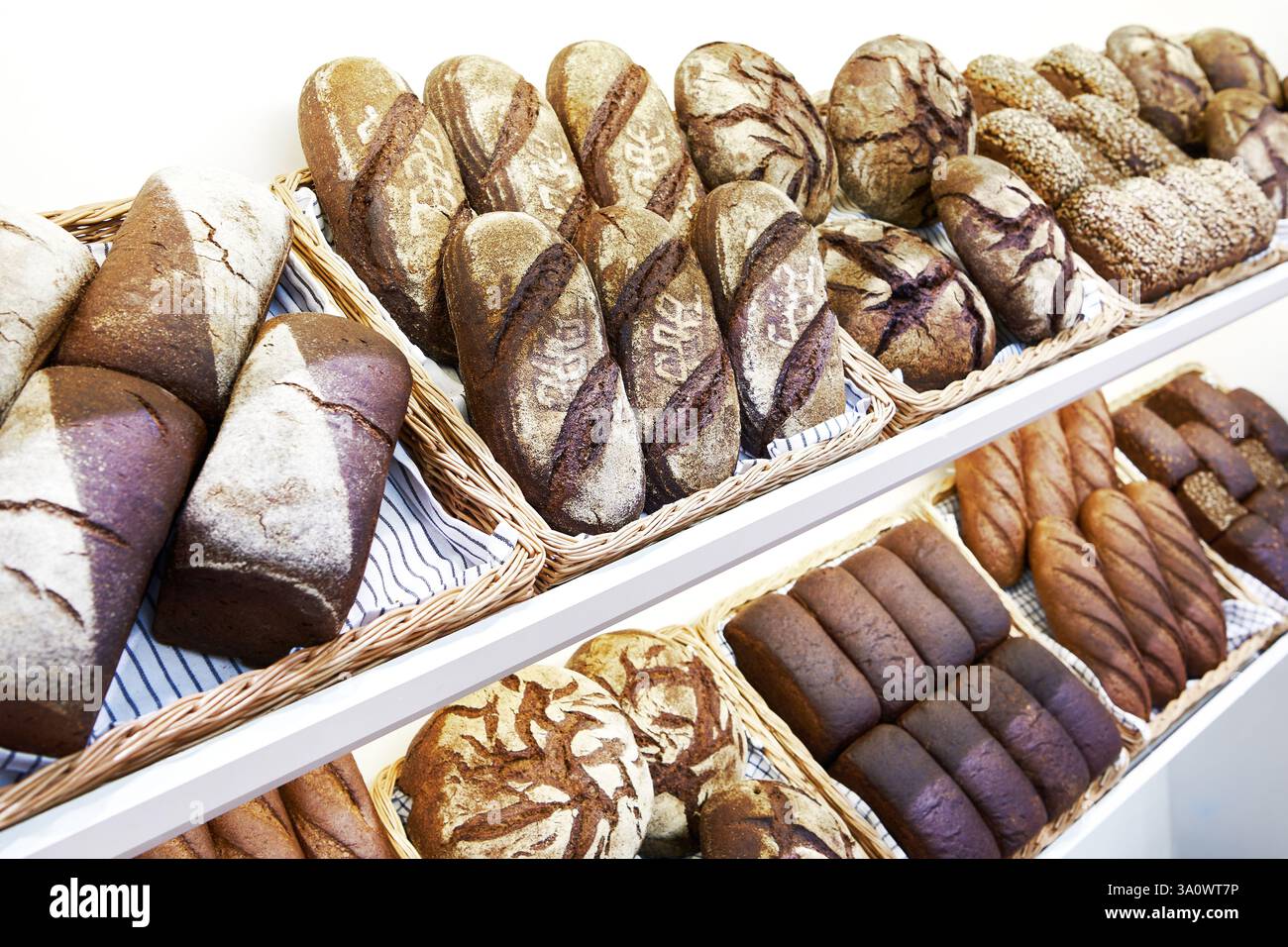 Fresh bread and pastries on shelves in a bakery Stock Photo - Alamy
