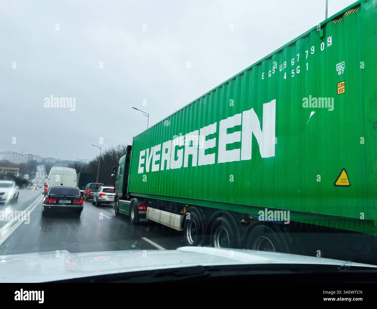 Kyiv, Ukraine - March 04, 2025: A view of traffic with a large green ...