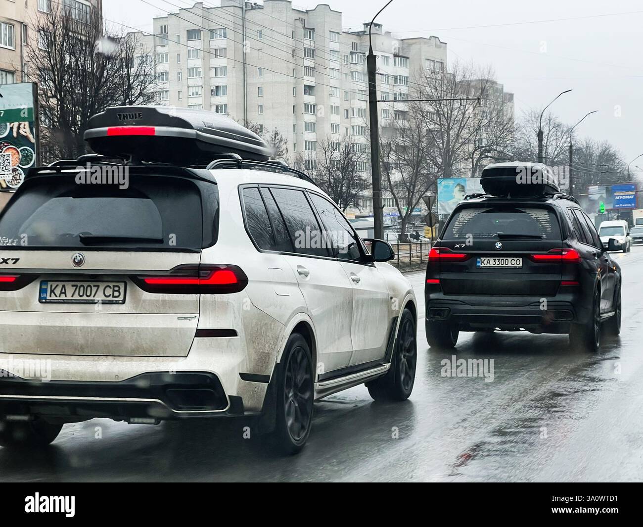 Kyiv, Ukraine - March 04, 2025: Urban scene featuring two large BMW X7 ...