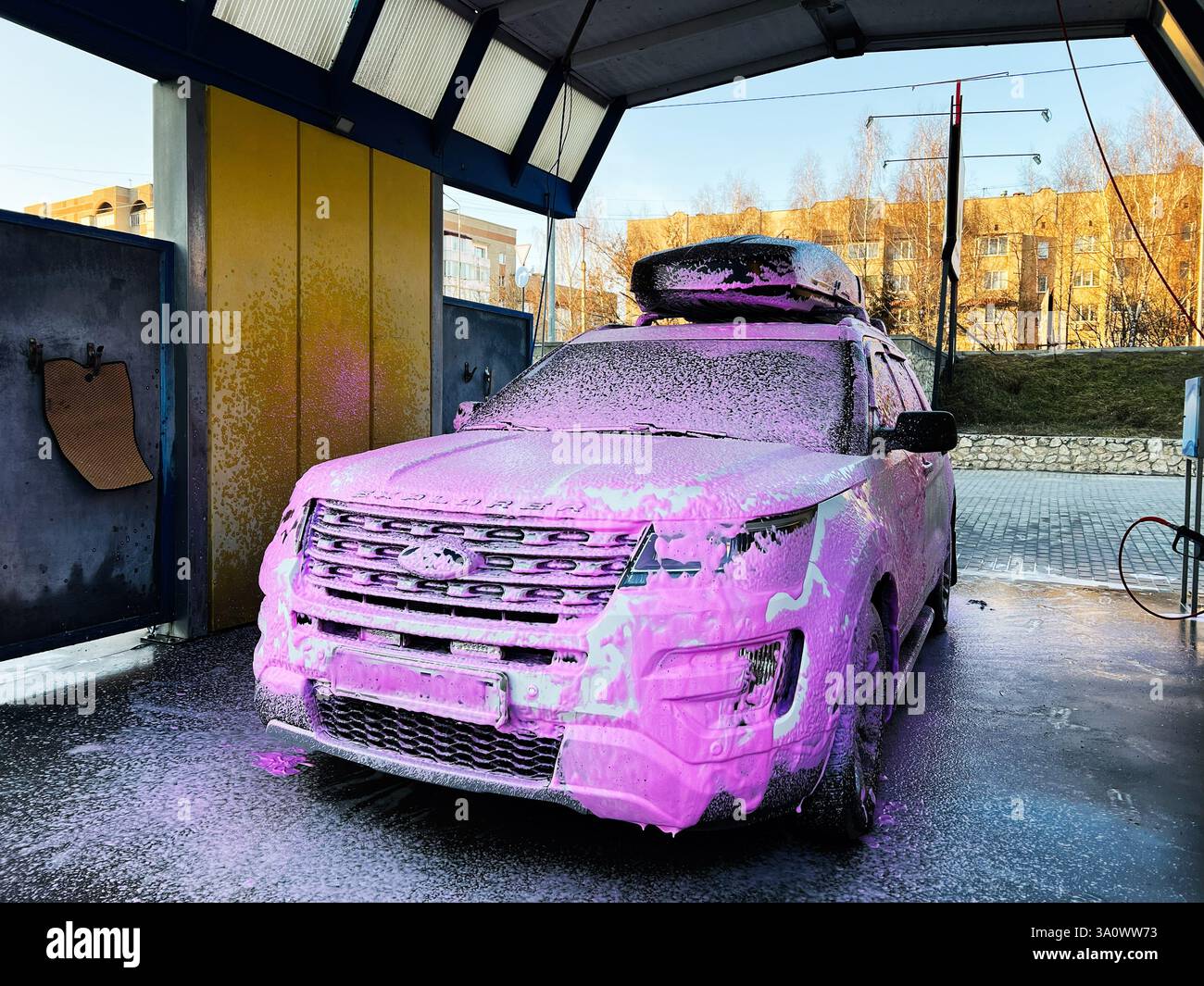 Kyiv, Ukraine - March 04, 2025: Large Ford Explorer SUV covered in pink ...