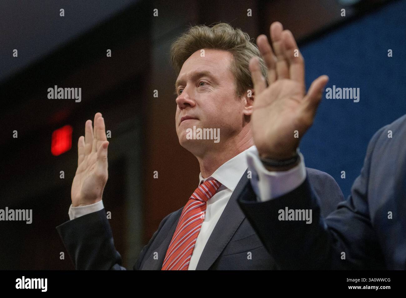 Denver Mayor Mike Johnston is sworn in during a House Committee on ...