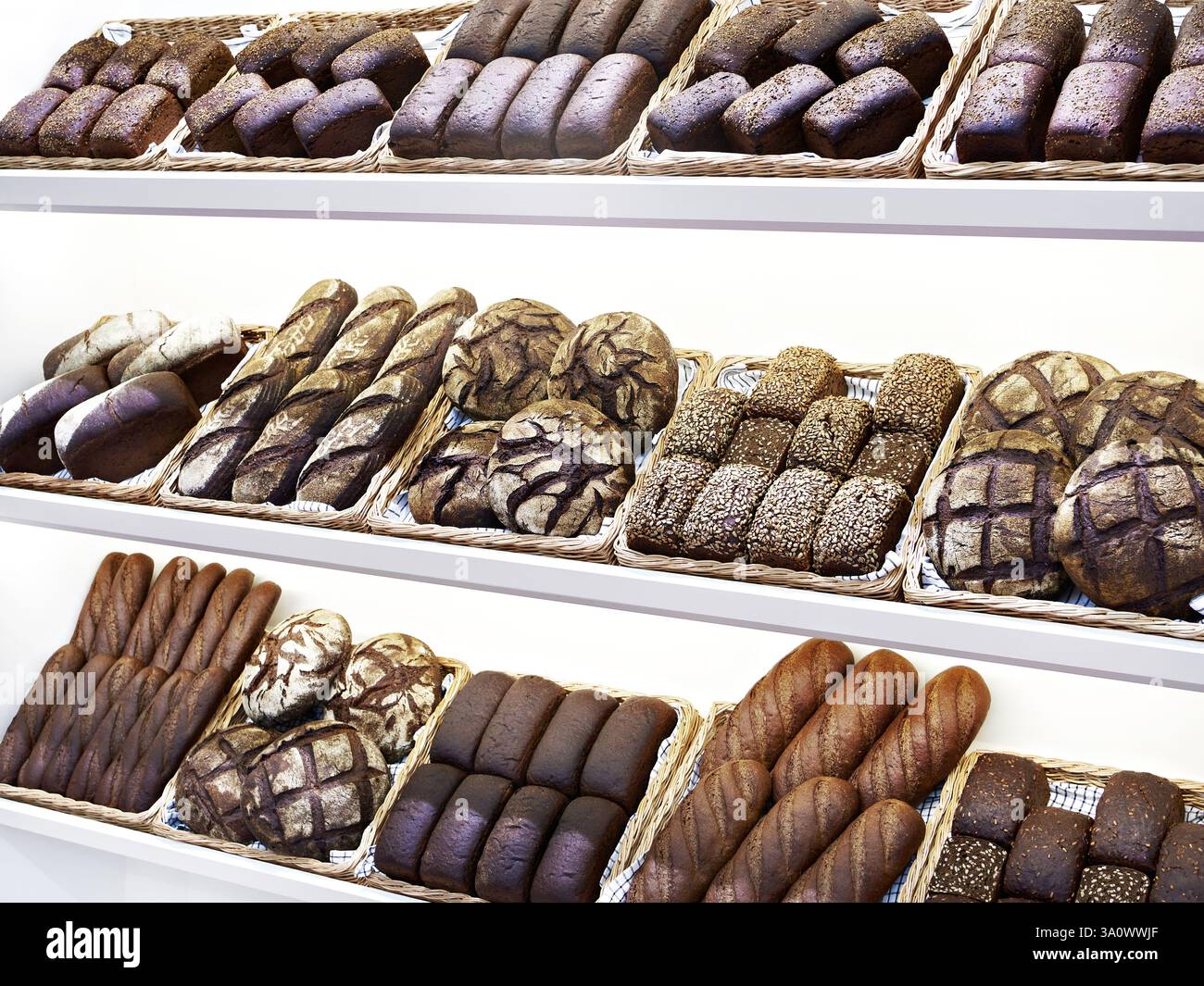 Fresh bread on shelves in a bakery Stock Photo - Alamy
