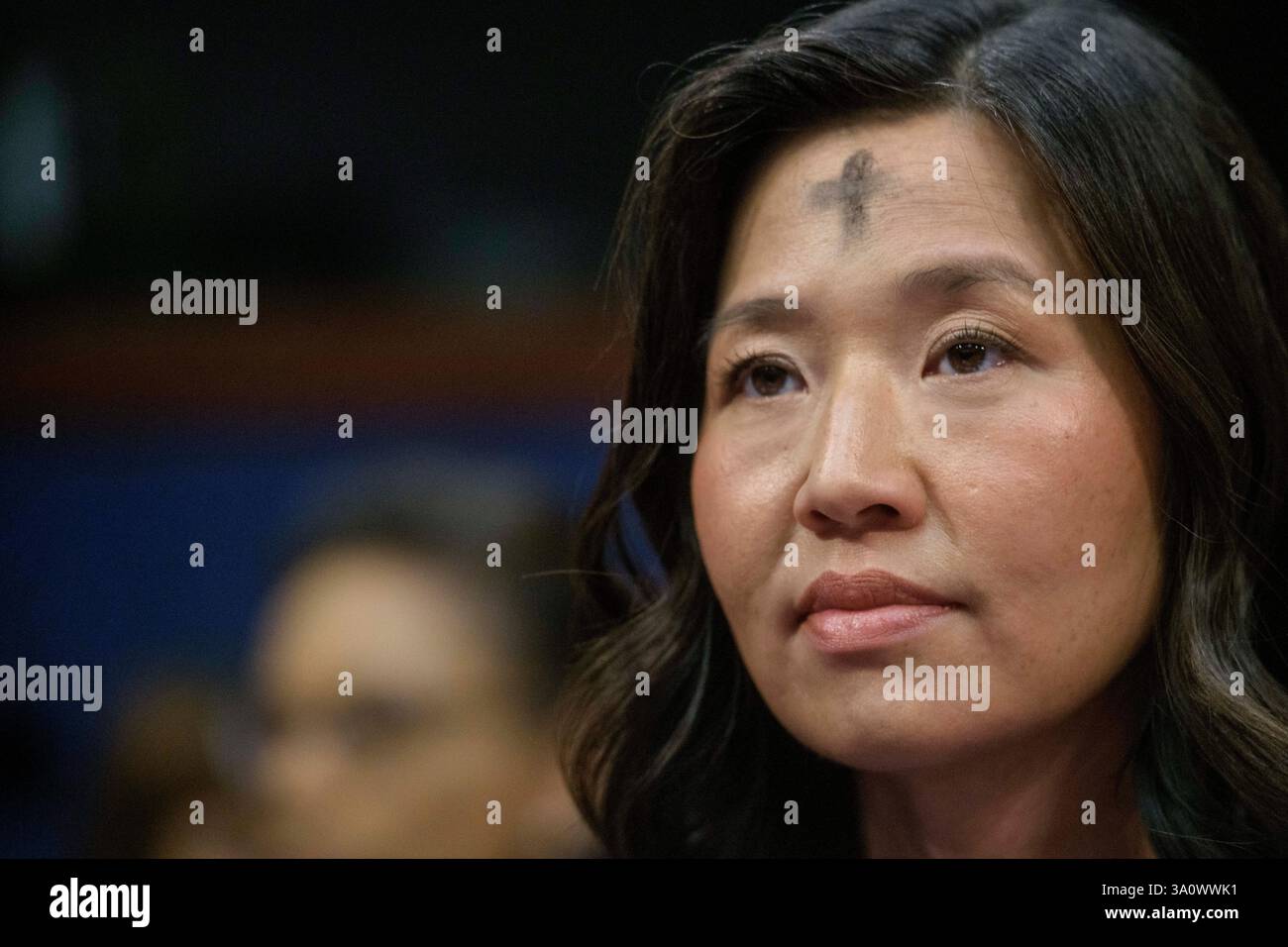 Boston Mayor Michelle Wu takes her seat at the witness table during a ...