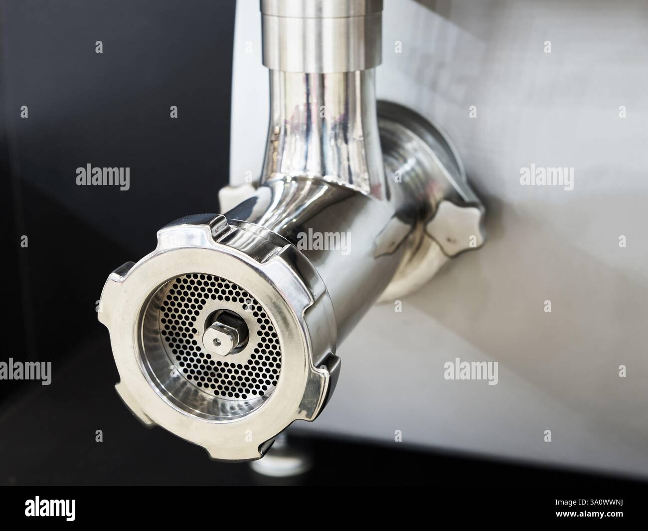 Electric metal meat grinder Stock Photo - Alamy