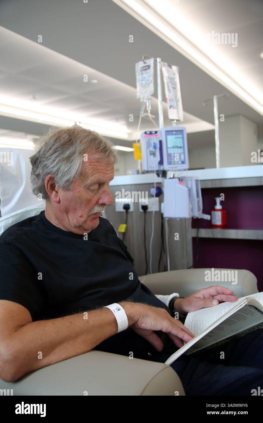 Cancer Patient Reading Book whilst having Chemotherapy Treatment with ...