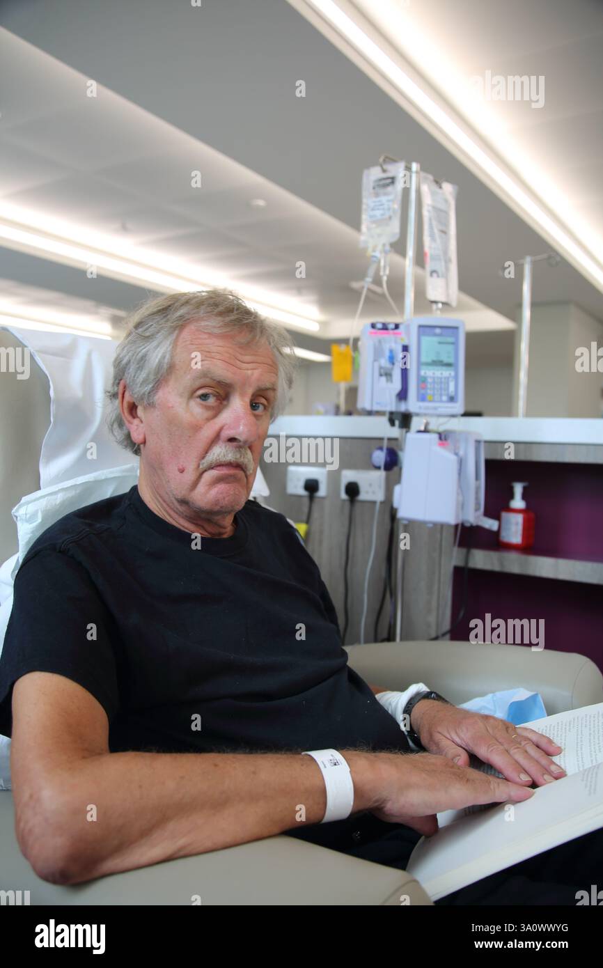 Cancer Patient Reading Book whilst having Chemotherapy Treatment with ...