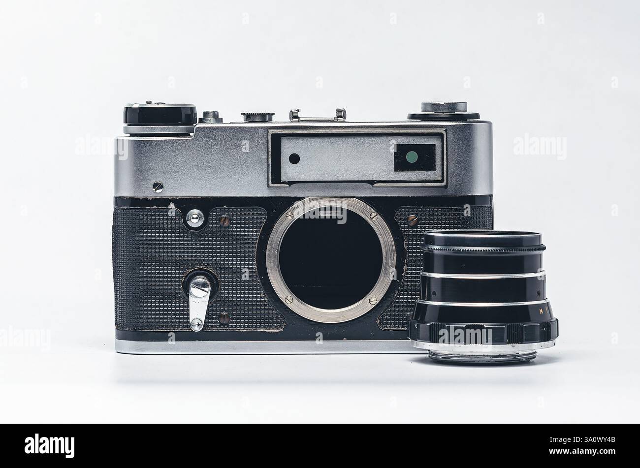 Vintage silver film camera with lens and black leather on white ...