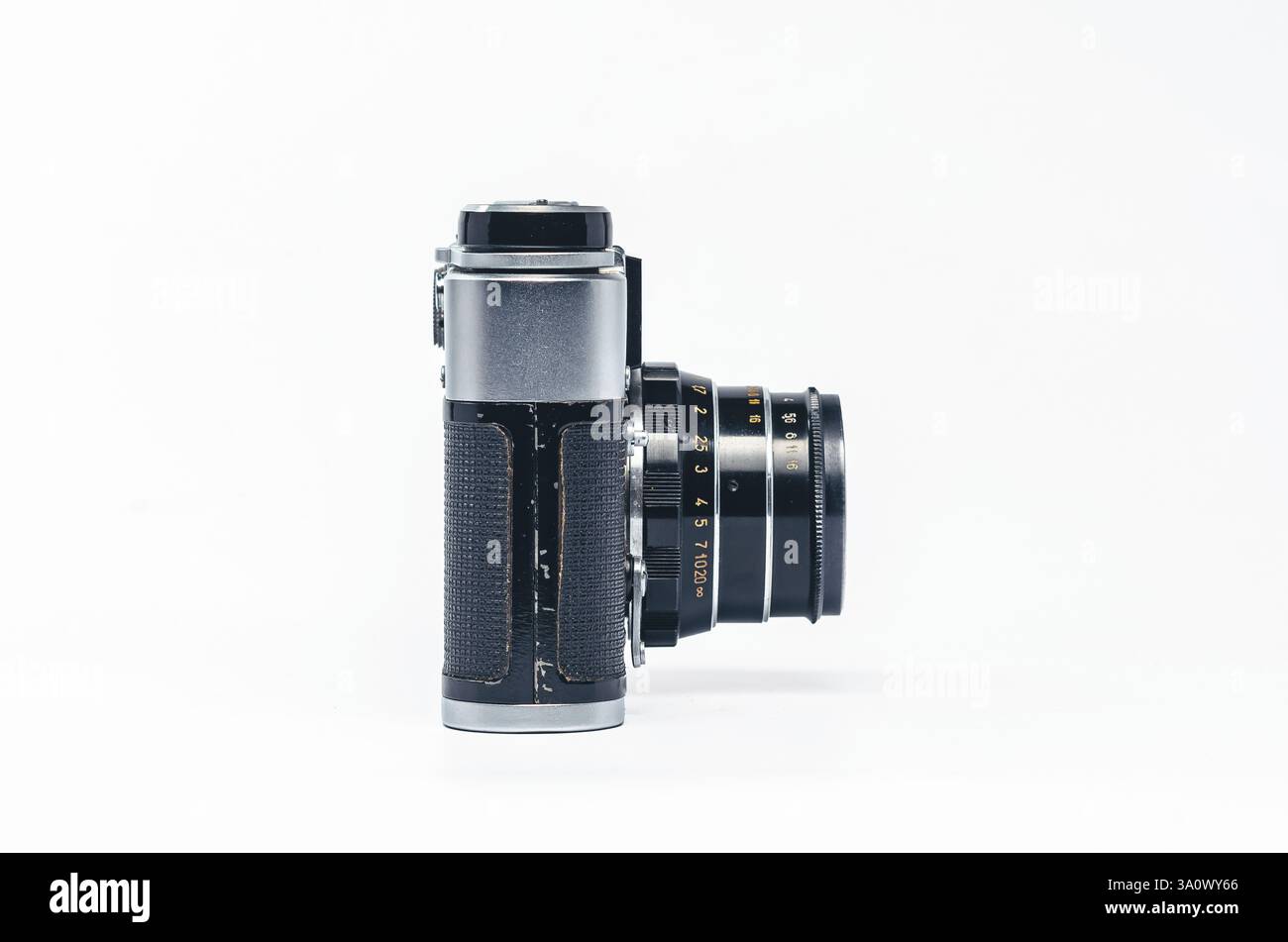 Classic silver and black film camera side profile on white background ...
