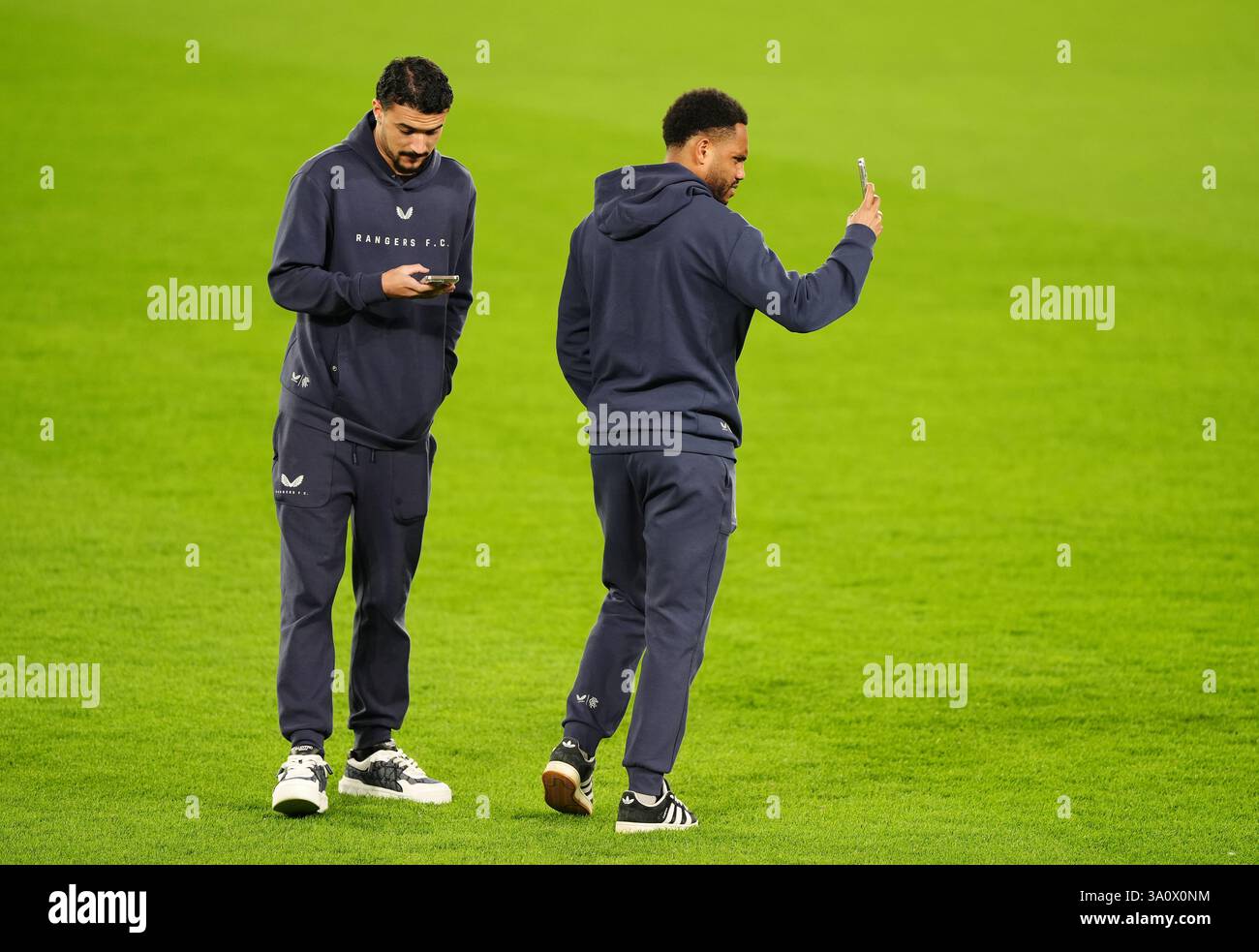 Rangers' Jefte and Danilo (right) inspect the pitch ahead of a press ...