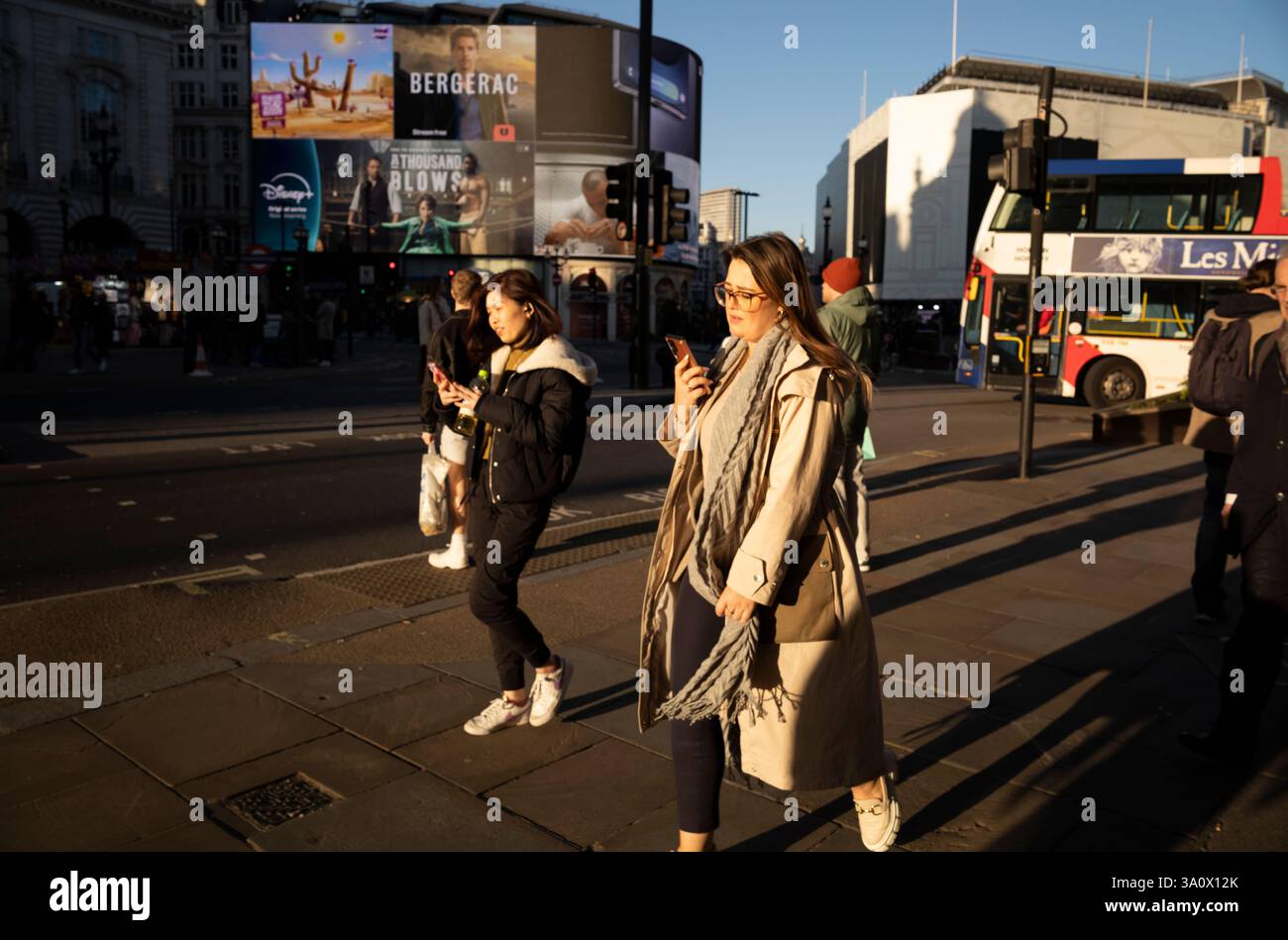 Pedestrians along Piccadilly, in the heart of the Mayfair district in London, enjoying the ...