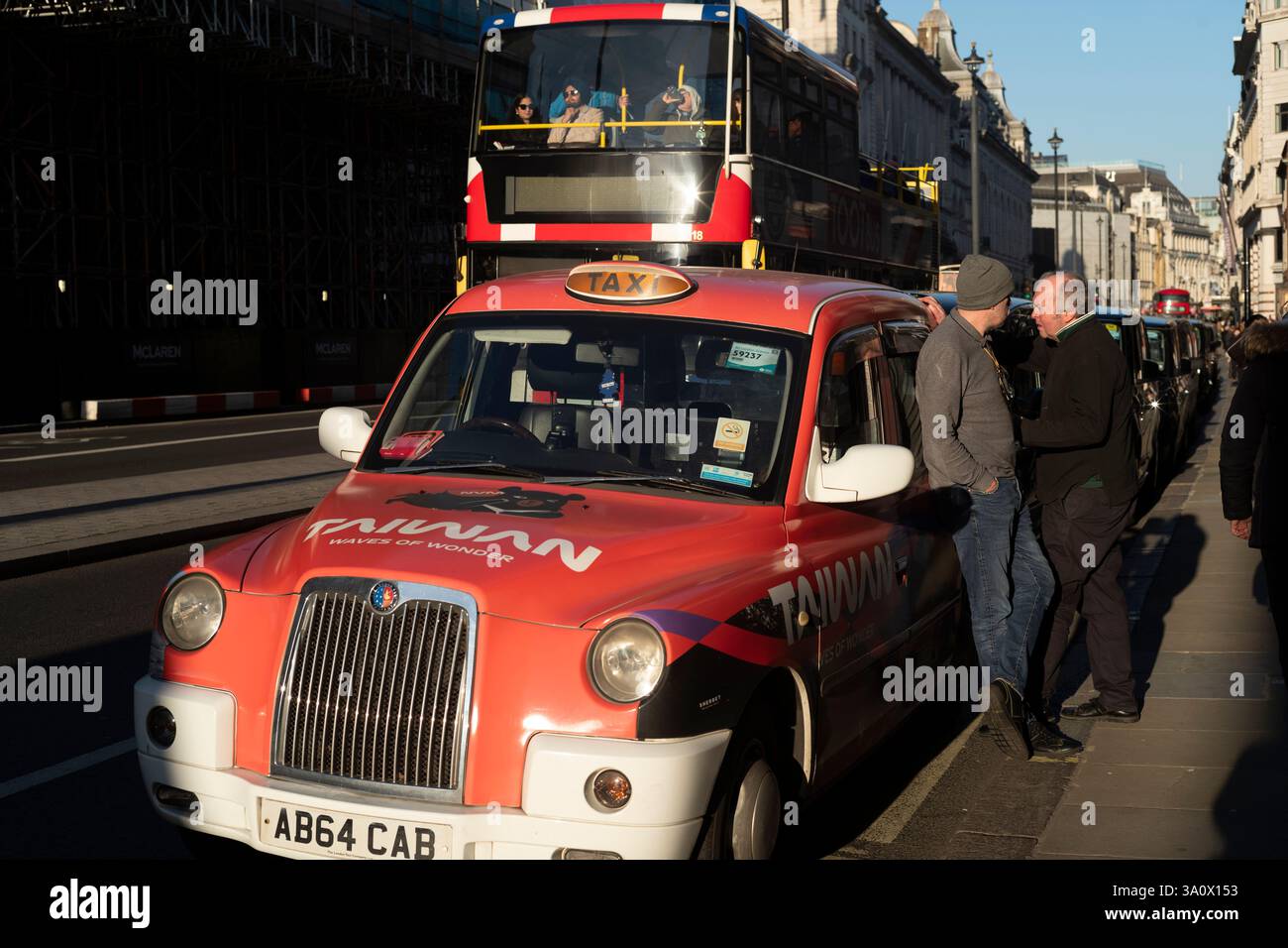 London black taxi cab drivers waiting for customers along Piccadilly in the heart of London's ...