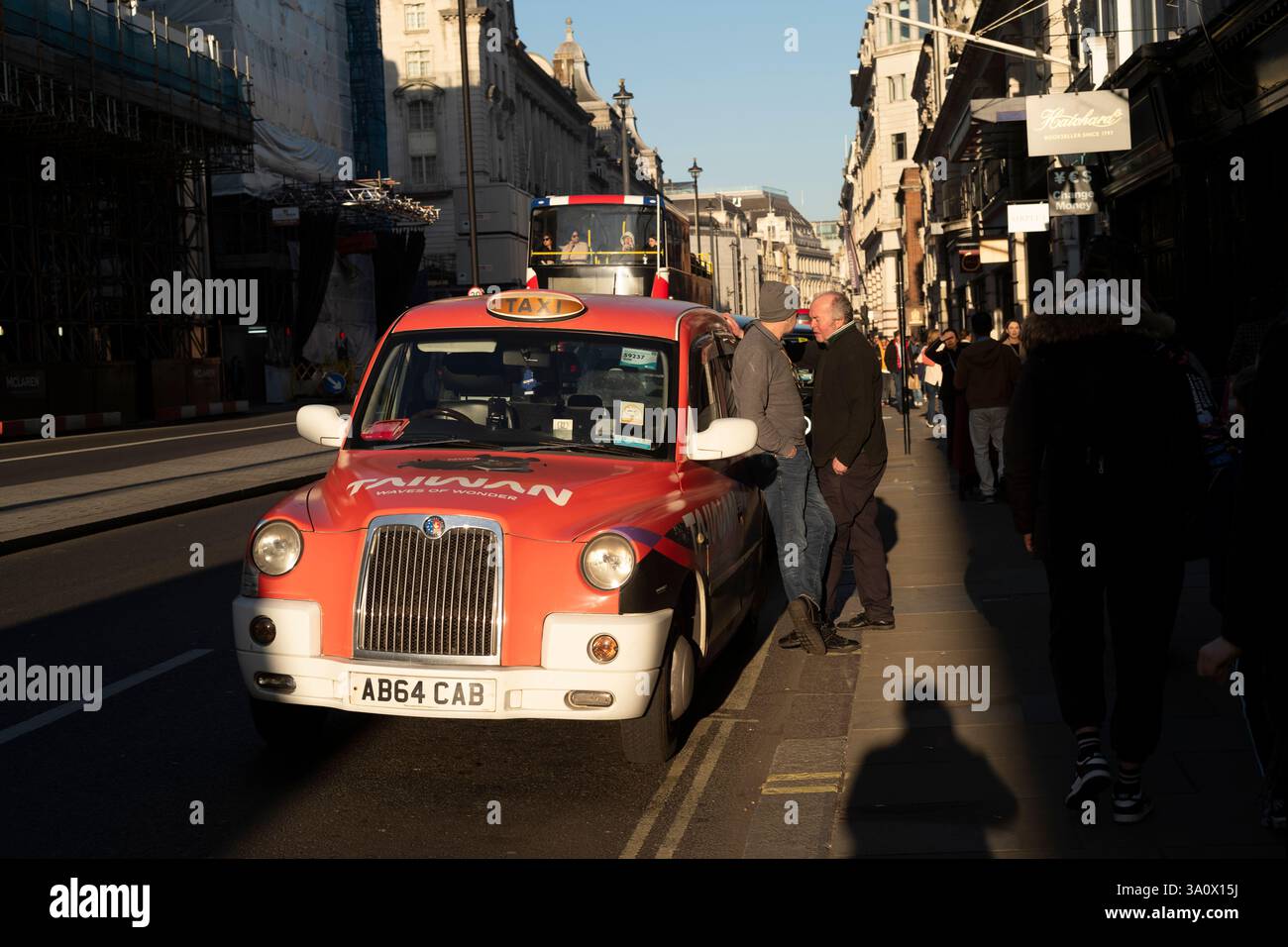 London black taxi cab drivers waiting for customers along Piccadilly in the heart of London's ...