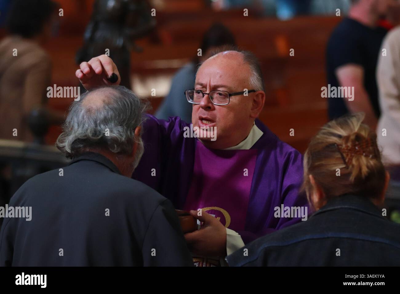 A Faithful catholic receives ashes during the imposition of ashes at ...