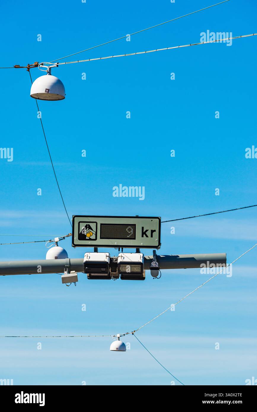 A modern traffic signal system is prominently displayed against a ...