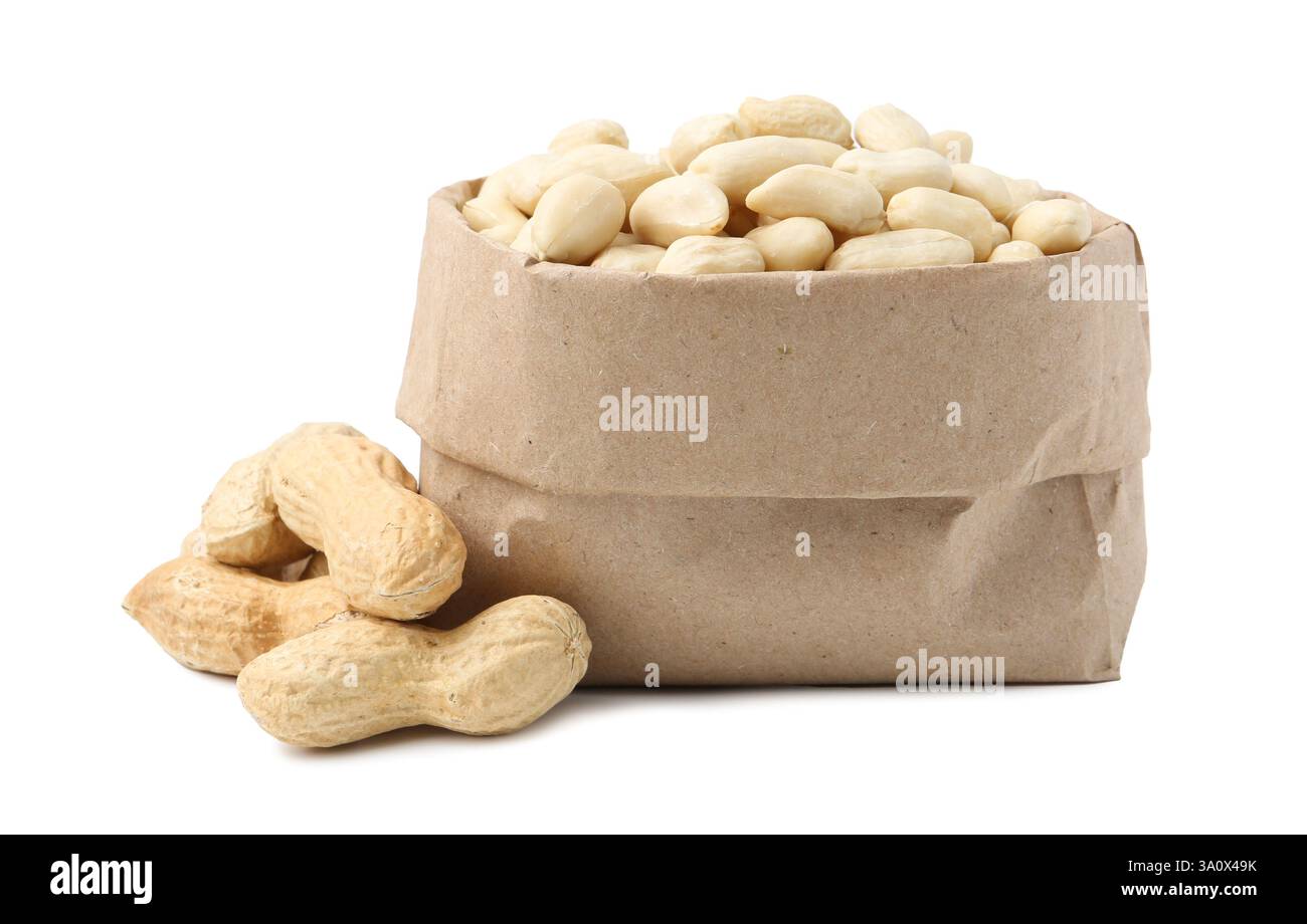 Peeled peanuts in paper bag and unpeeled ones isolated on white Stock ...