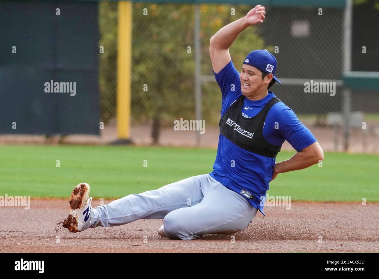 Los Angeles Dodgers' Shohei Ohtani works on his base running skills ...