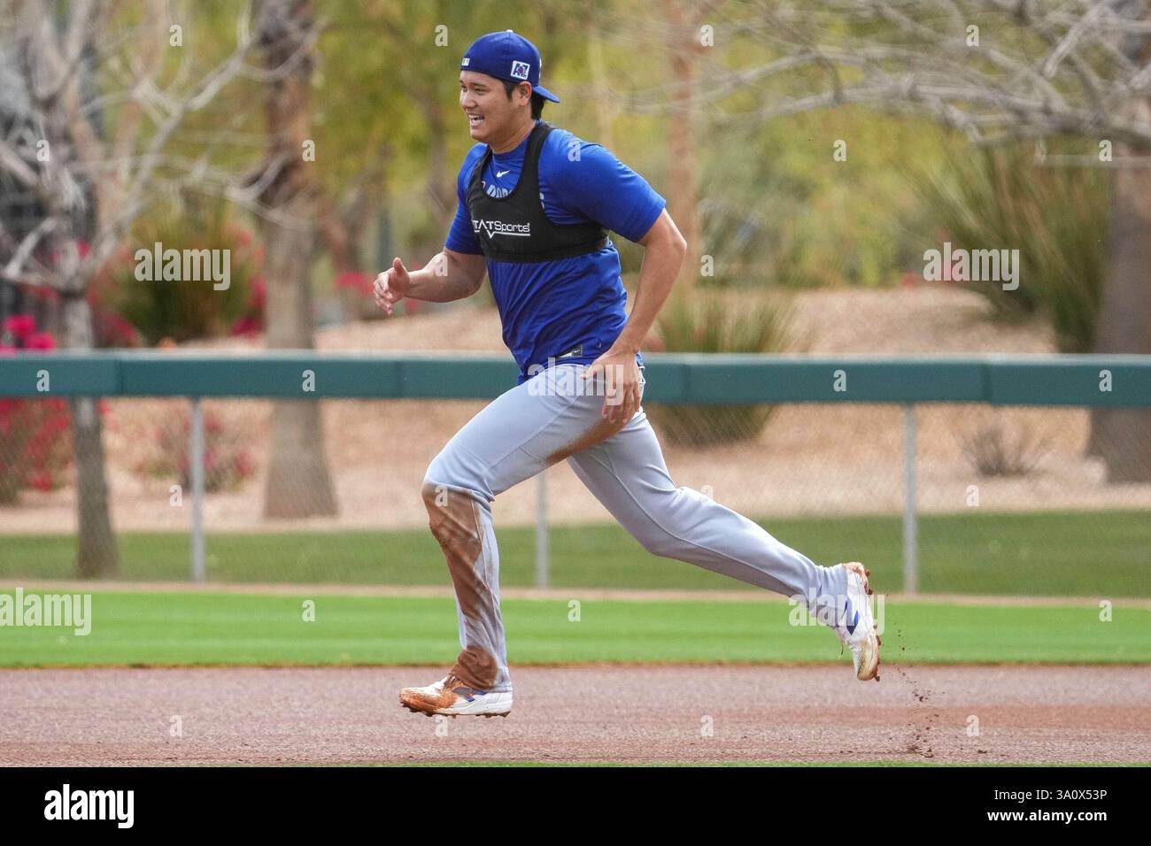 Los Angeles Dodgers' Shohei Ohtani works on his base running skills ...
